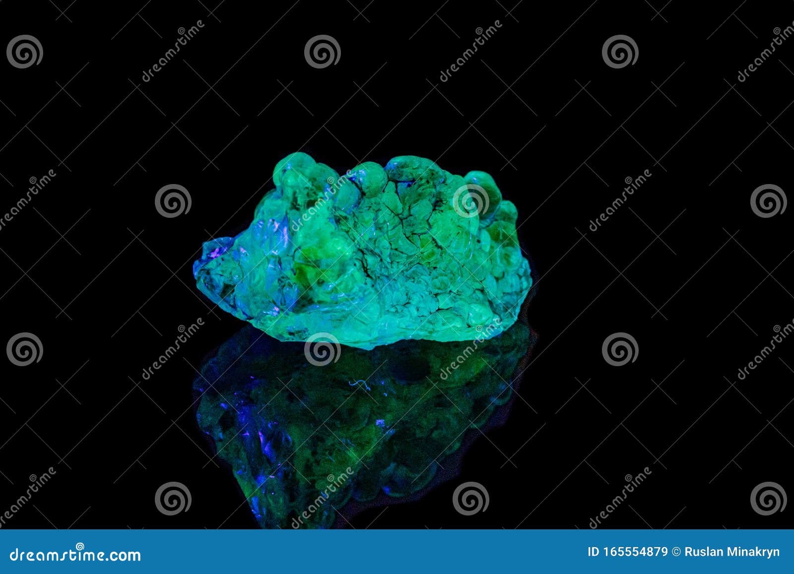 Macro Mineral Stone Opal Under Ultraviolet Light on a Black Background ...