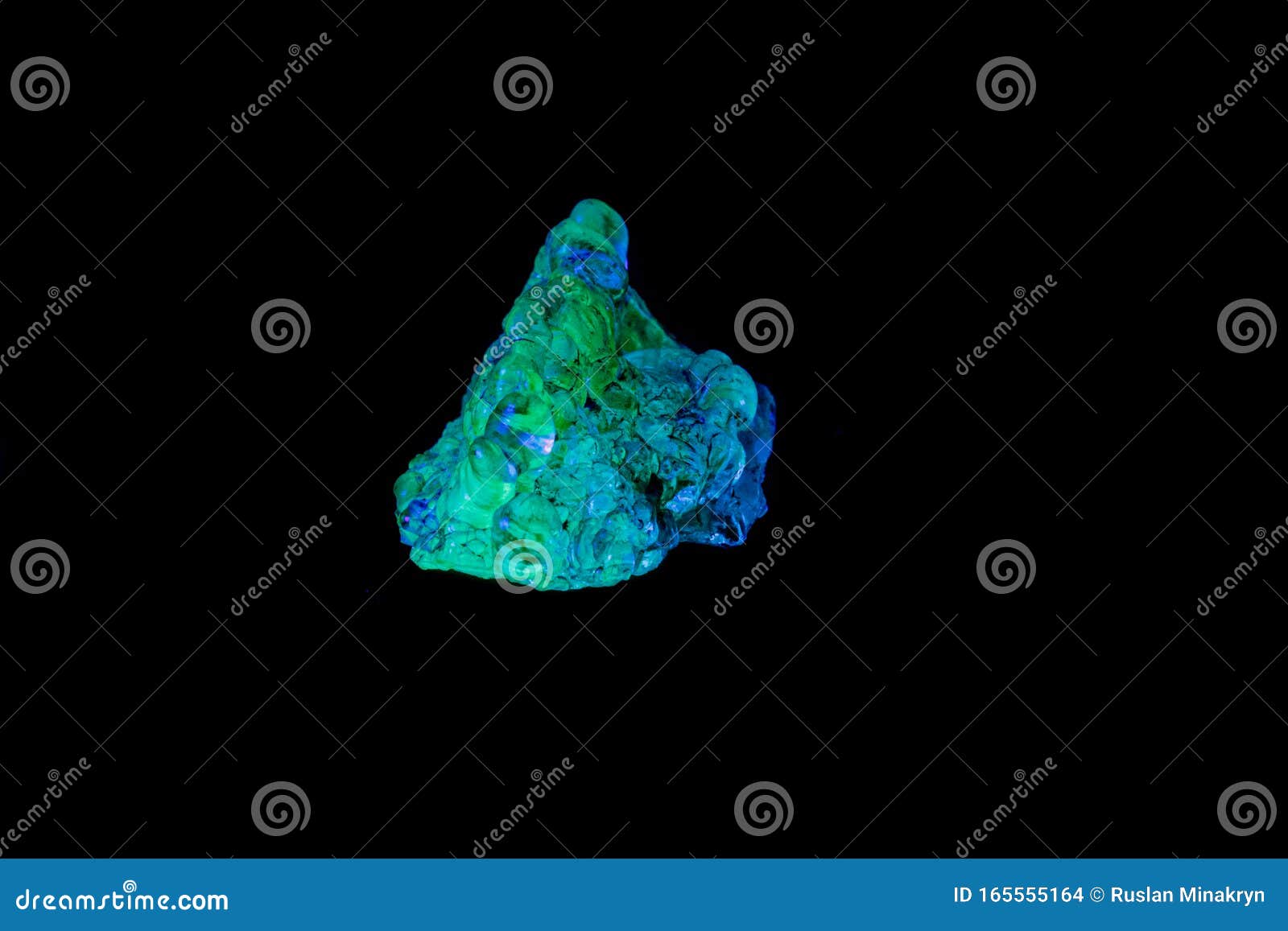 Macro Mineral Stone Opal Under Ultraviolet Light on a Black Background ...