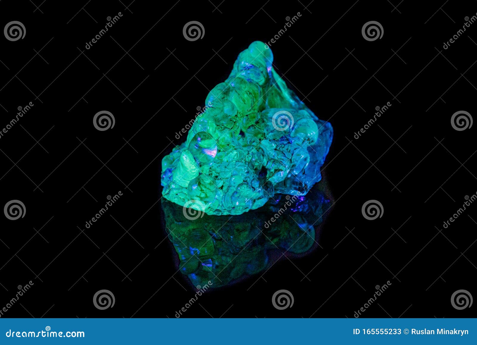 Macro Mineral Stone Opal Under Ultraviolet Light on a Black Background ...