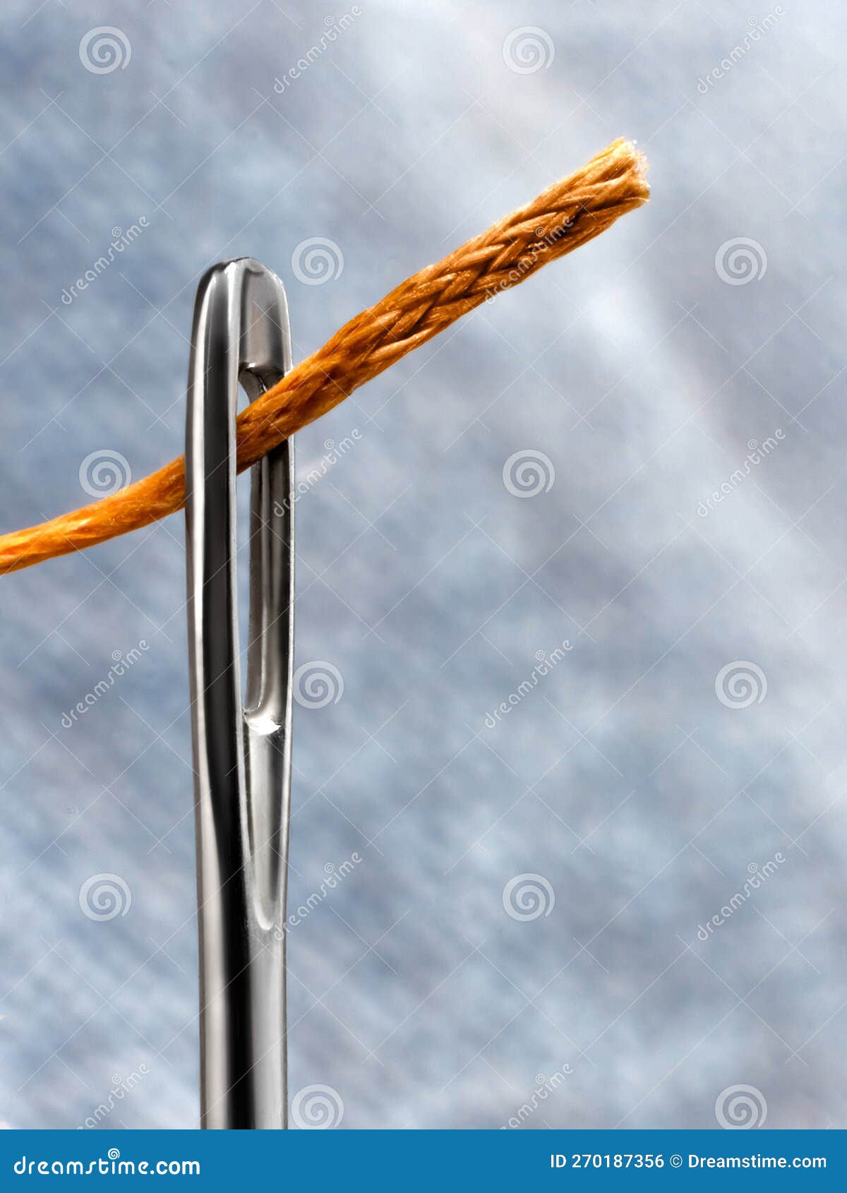 Photo of a Needle and a Thread Threaded through the Eye of a Needle ...