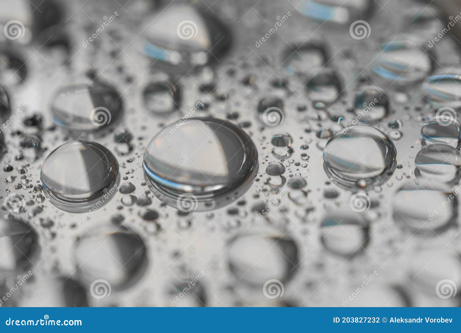 Macro Photography of Water Drops on a Mirror Reflective Surface. Stock ...