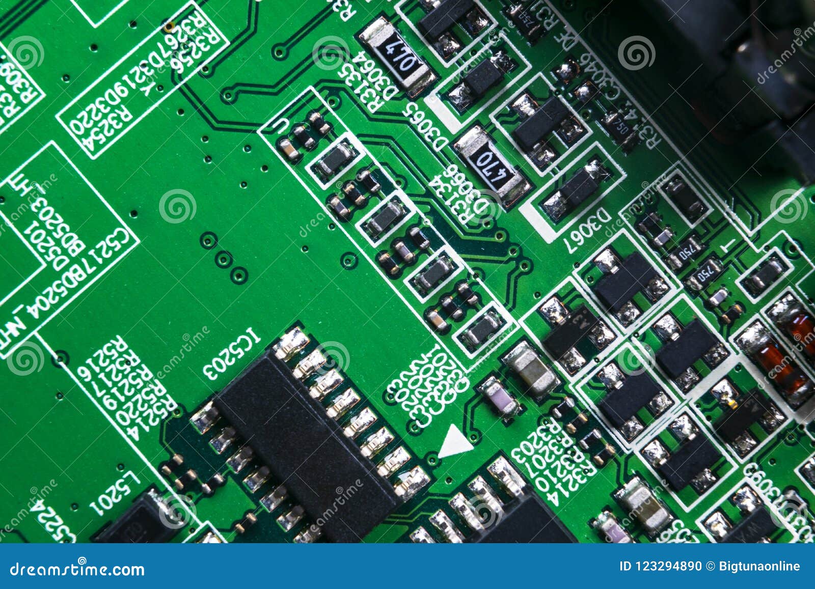 Macro Shot of a Circuitboard with Resistors Microchips and Electronic ...