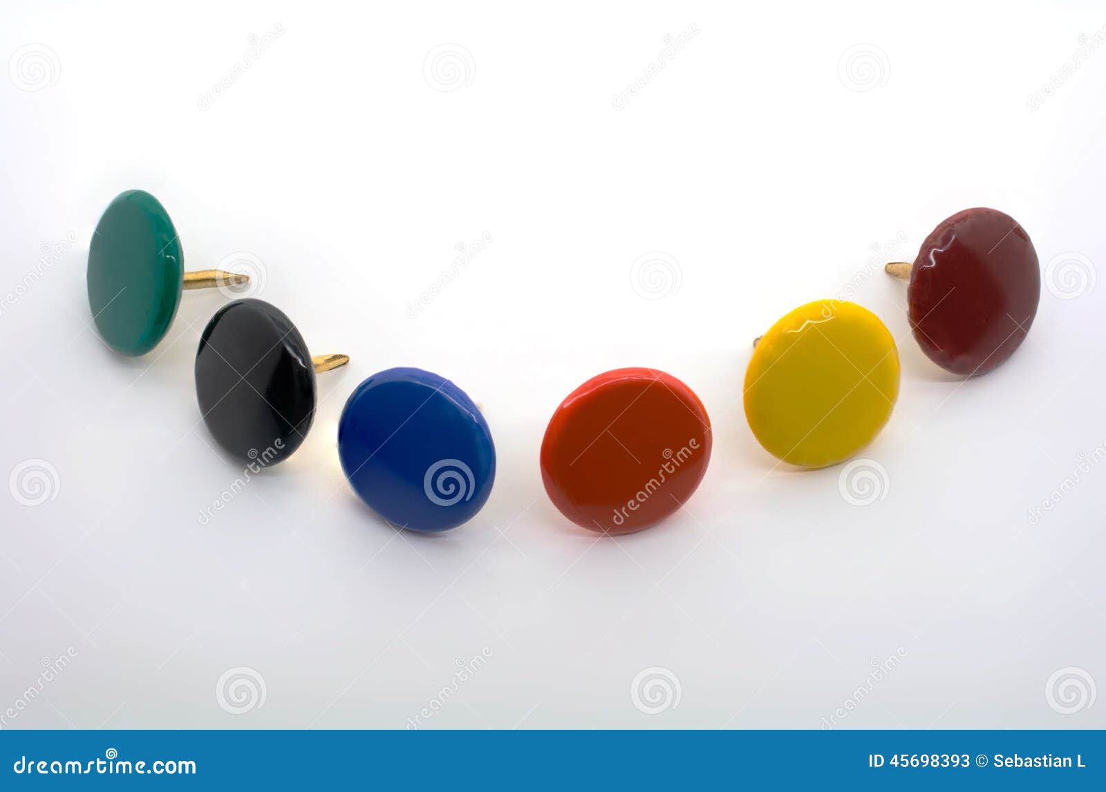 A Macro Shot of a Collection of Six Colored Thumbtacks Stock Image ...