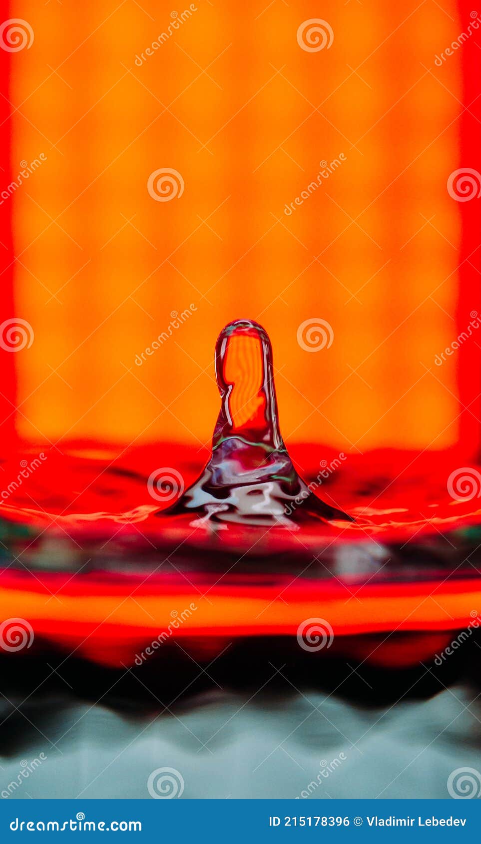 Macro Shot of a Drop of Water Falling into a Glass Cup with Drinking ...
