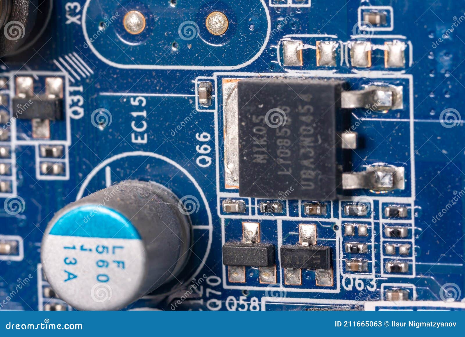 Macro Shot of a Microcircuit and a Transistor on the Motherboard of a ...