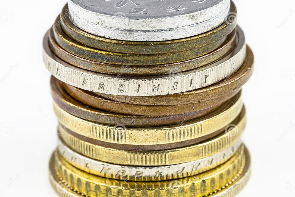 A Macro Shot of a Stack of Coins Stacked in a Bar, Isolated on a White ...
