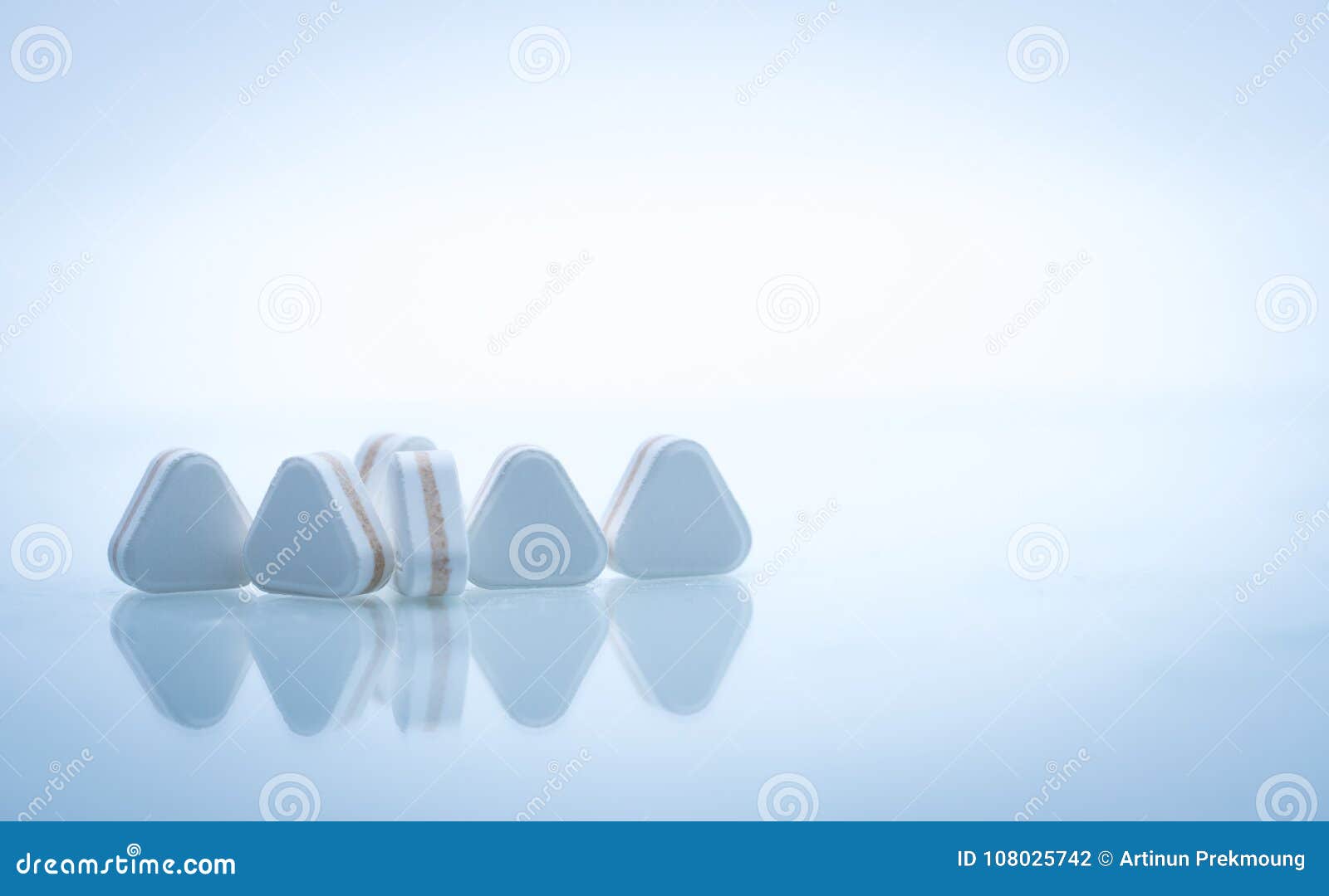 Macro Shot of Triangle Shape Tablet Pills. Three Layers Tablet Stock ...