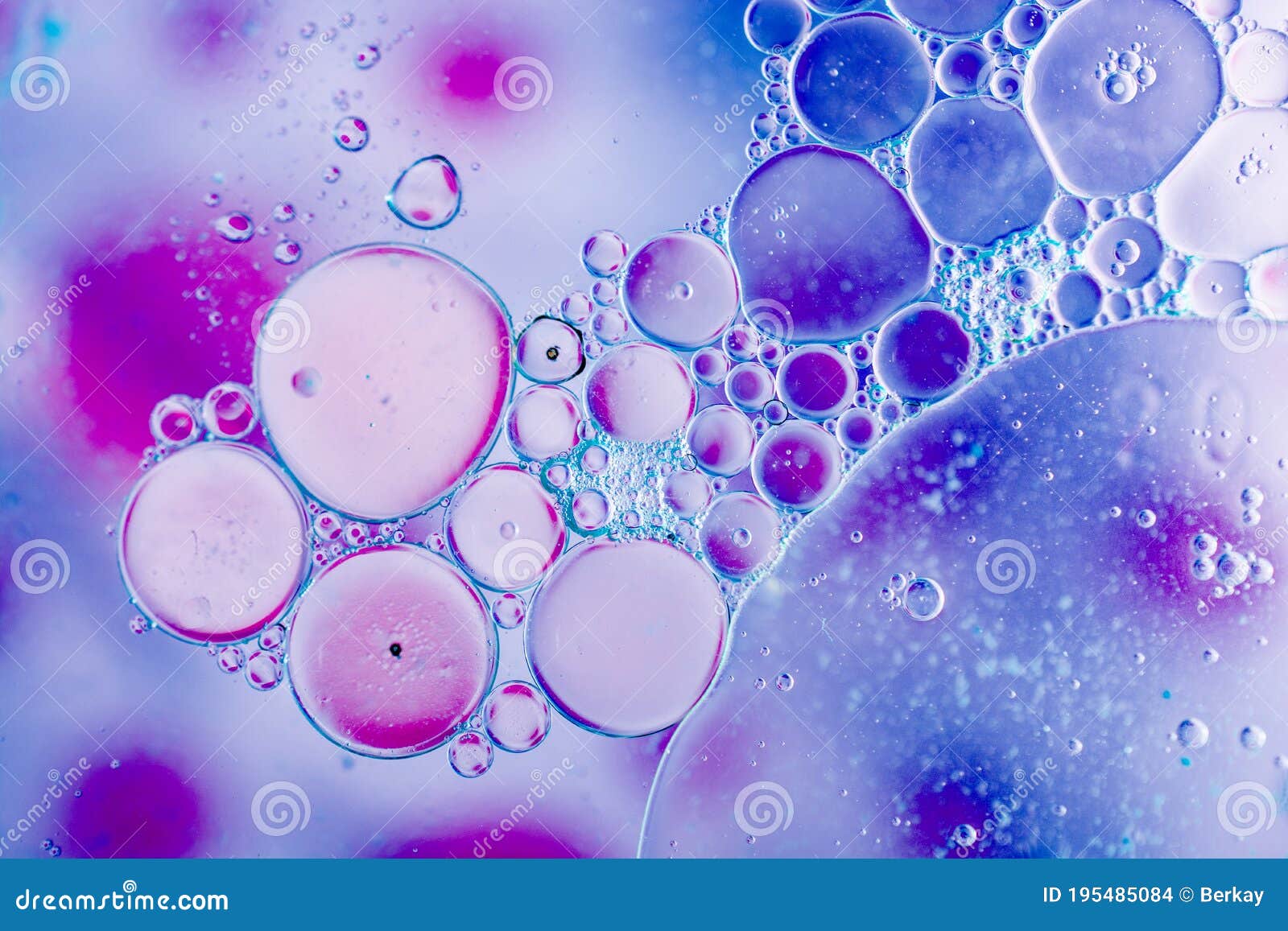 Macro Shot of Water Oil Emulsion Over Colored Background Stock Photo ...