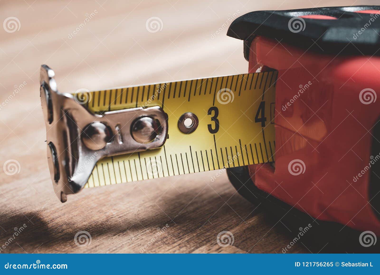Macro of a Solid Measuring Tape with Pulled Out Scale Lying on a Table ...