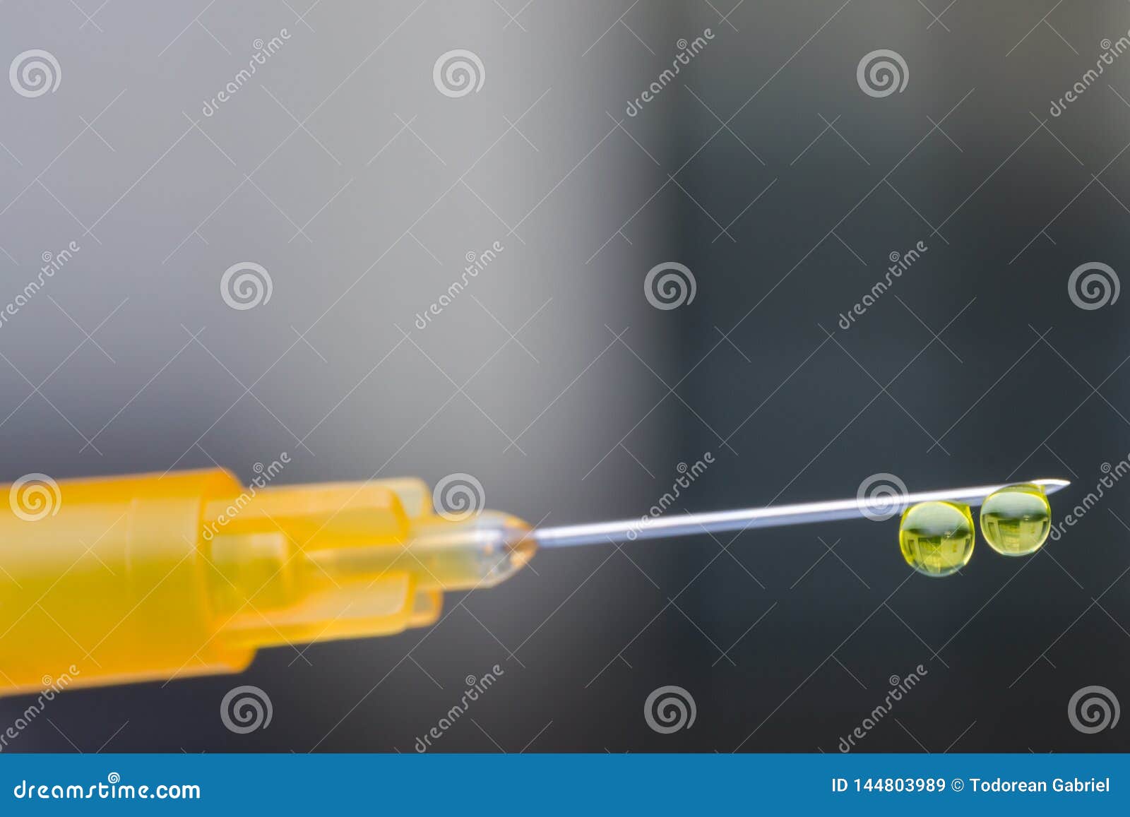 Macro View of a Hypodermic Needle with Two Drops of Drug Solution on ...