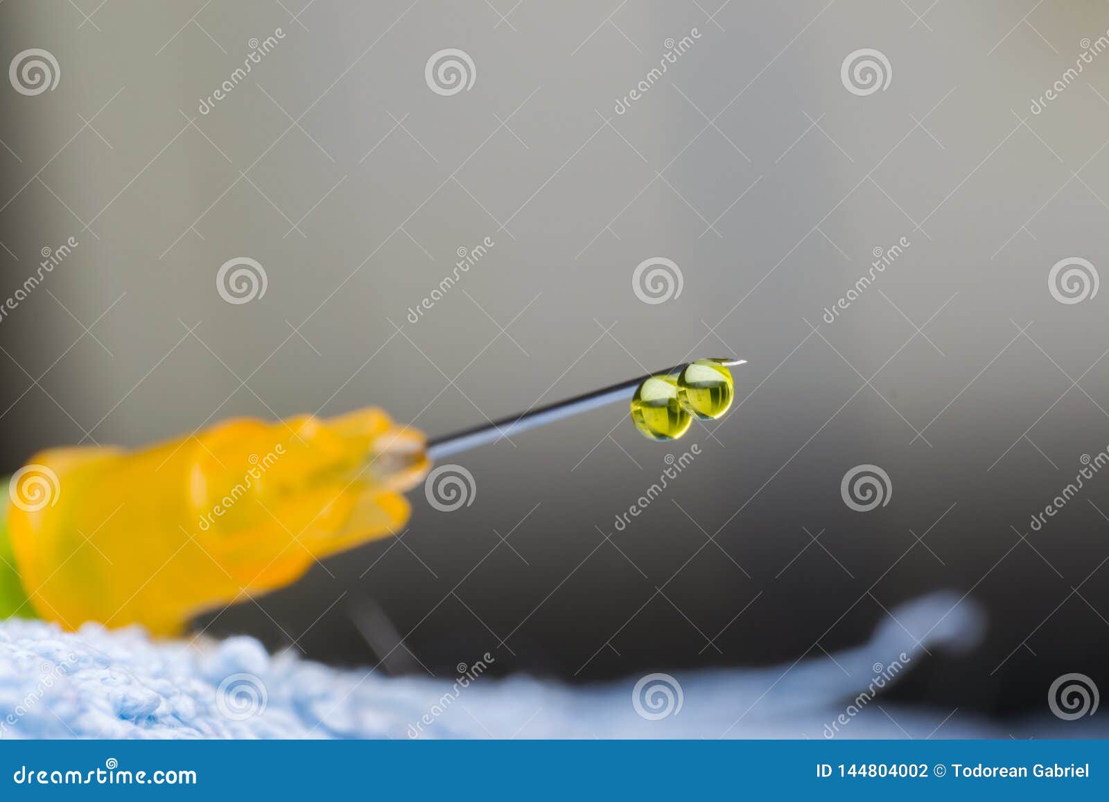 Macro View of a Hypodermic Needle with Two Drops of Drug Solution on ...