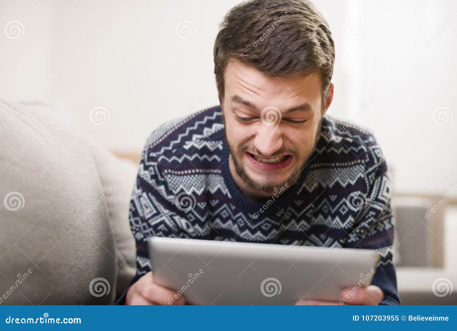 Mad Man with Digital Tablet Lying on the Couch. Stock Image - Image of ...