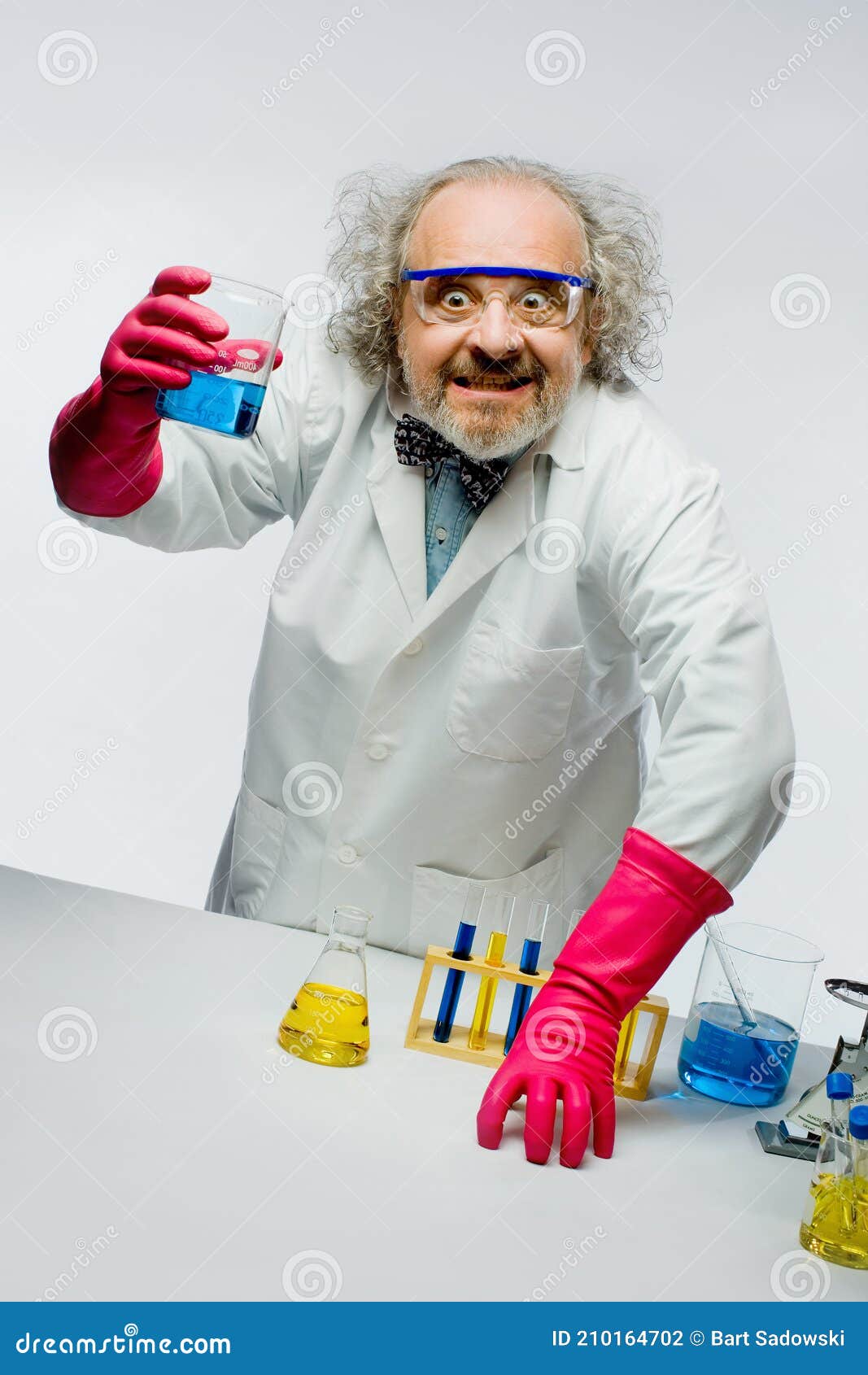 Mad Scientist Holding a Beaker with Blue Liquid Stock Photo - Image of ...