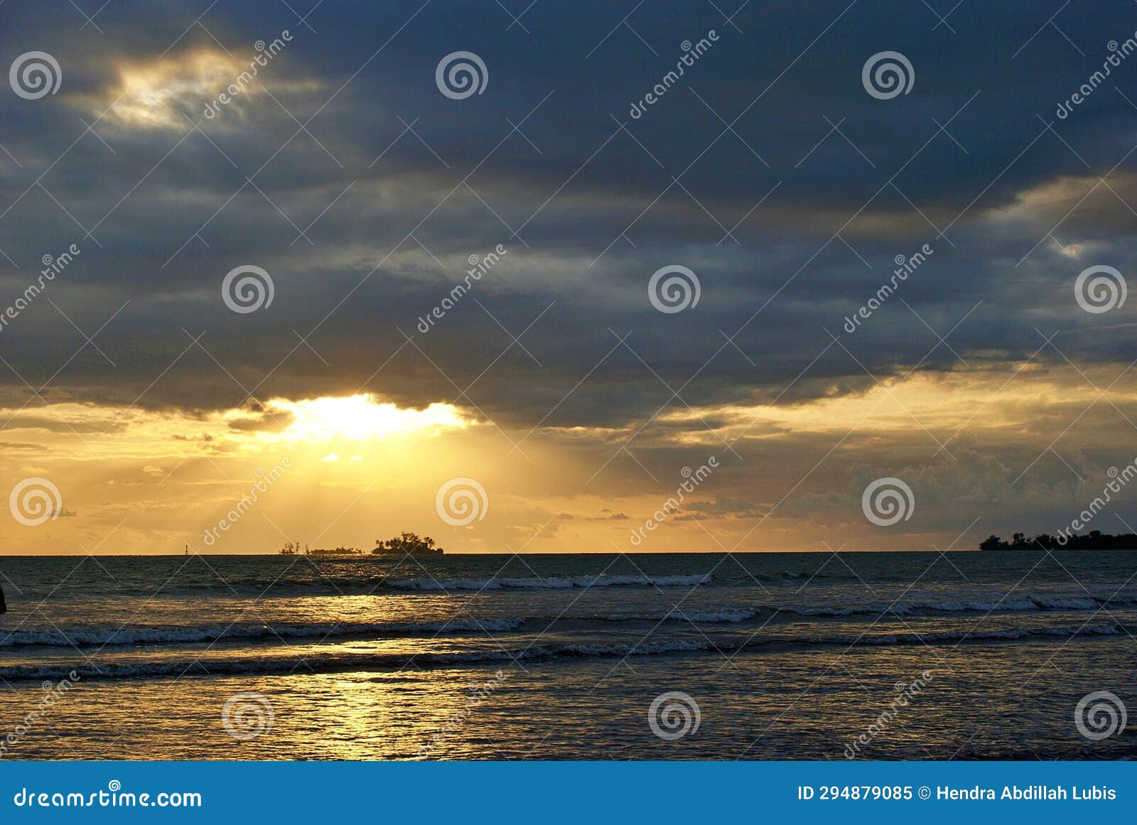 Sunlight Rays and Reflection on a Cloudy Beach Stock Image - Image of ...