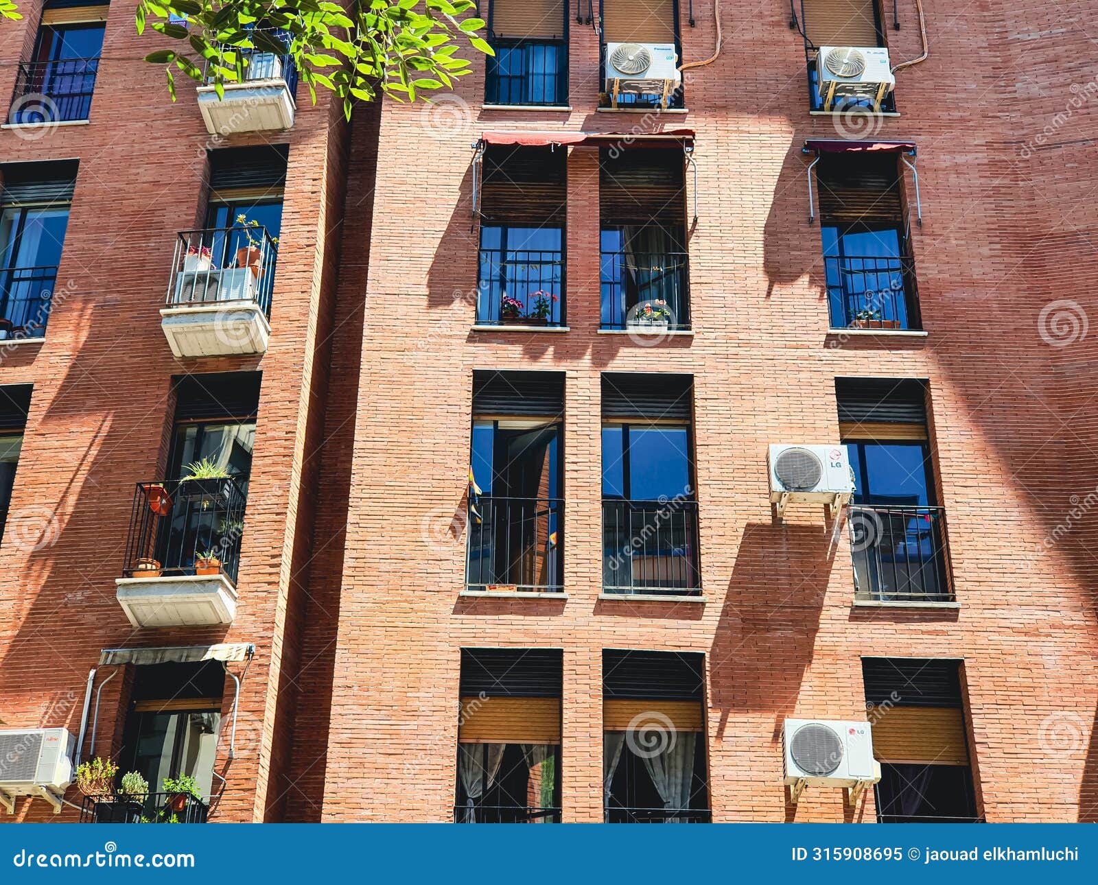 Madrid, Sp Low Angle View of a Red Bricks Building Facade with Windows ...