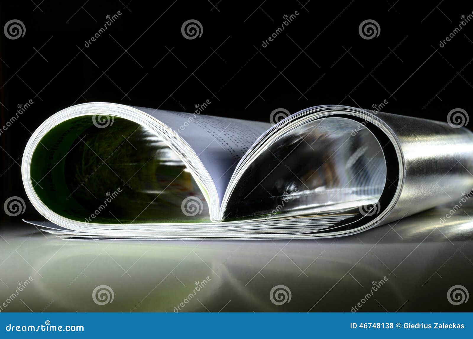 Magazine on Reflective Surface Stock Photo - Image of media, glossy ...