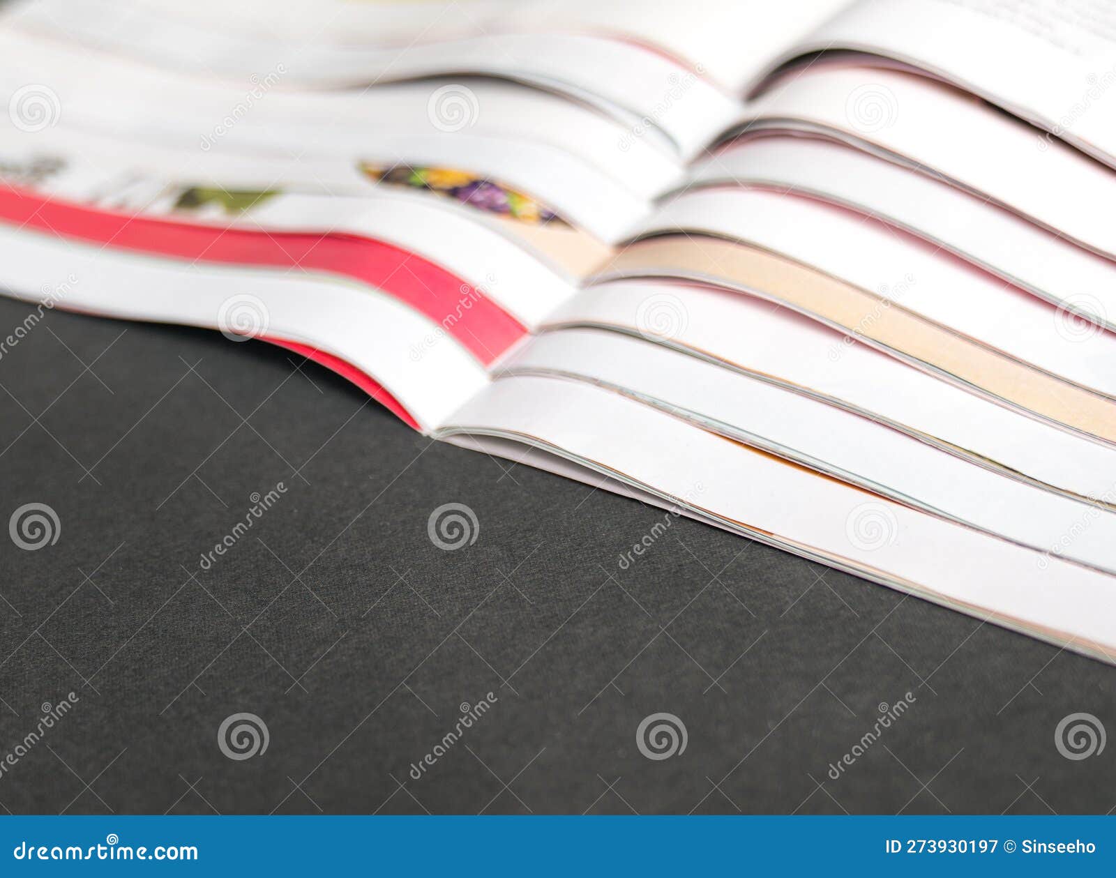 Magazines open on table stock image. Image of paper - 273930197