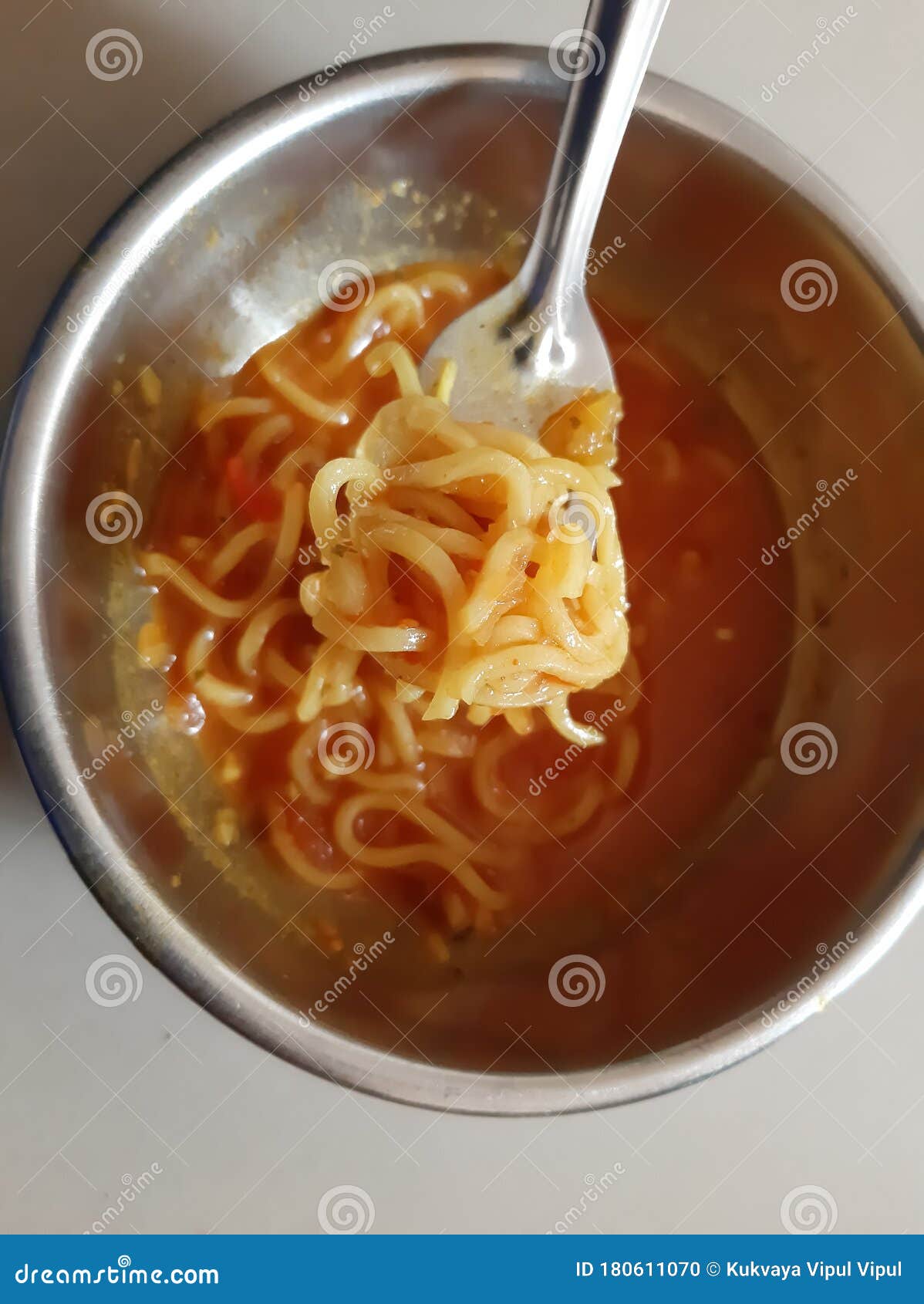 Maggi in a Spoon in a Steel Bowl. Stock Photo - Image of noodle, maggi ...