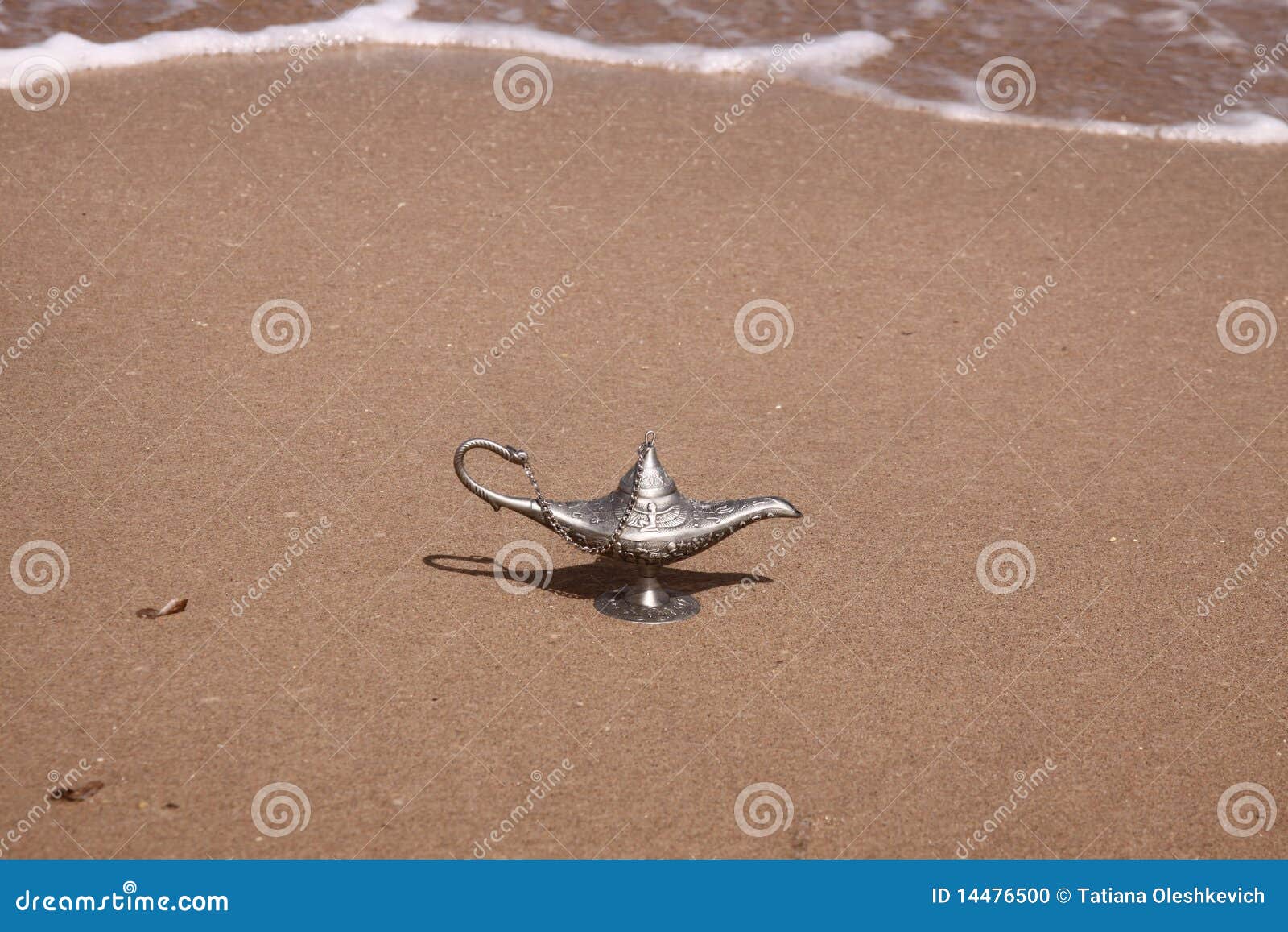 Magic lamp on a sand stock photo. Image of buried, locked - 14476500