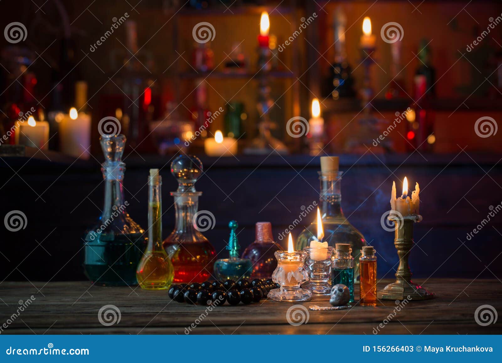 Magic Potions in Bottles on Wooden Table Stock Image - Image of ...