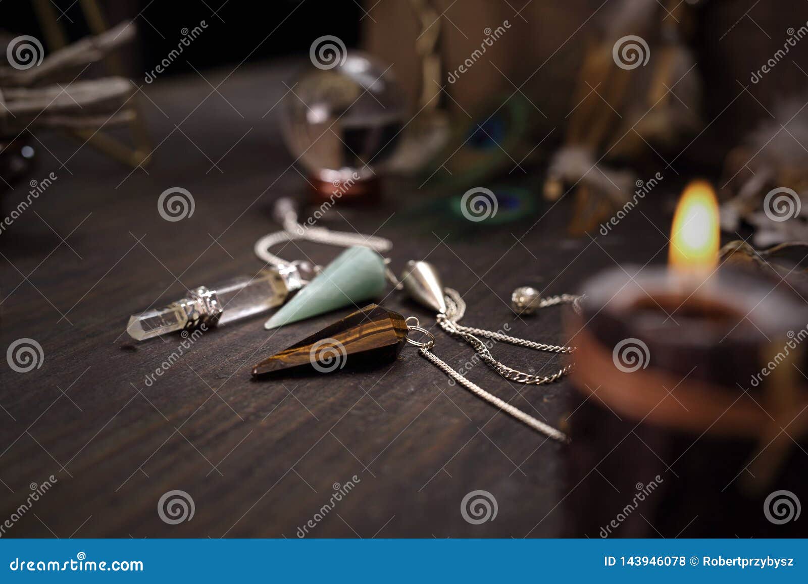 Magic and Spells Using a Pendulum of Natural Stones. Stock Photo ...