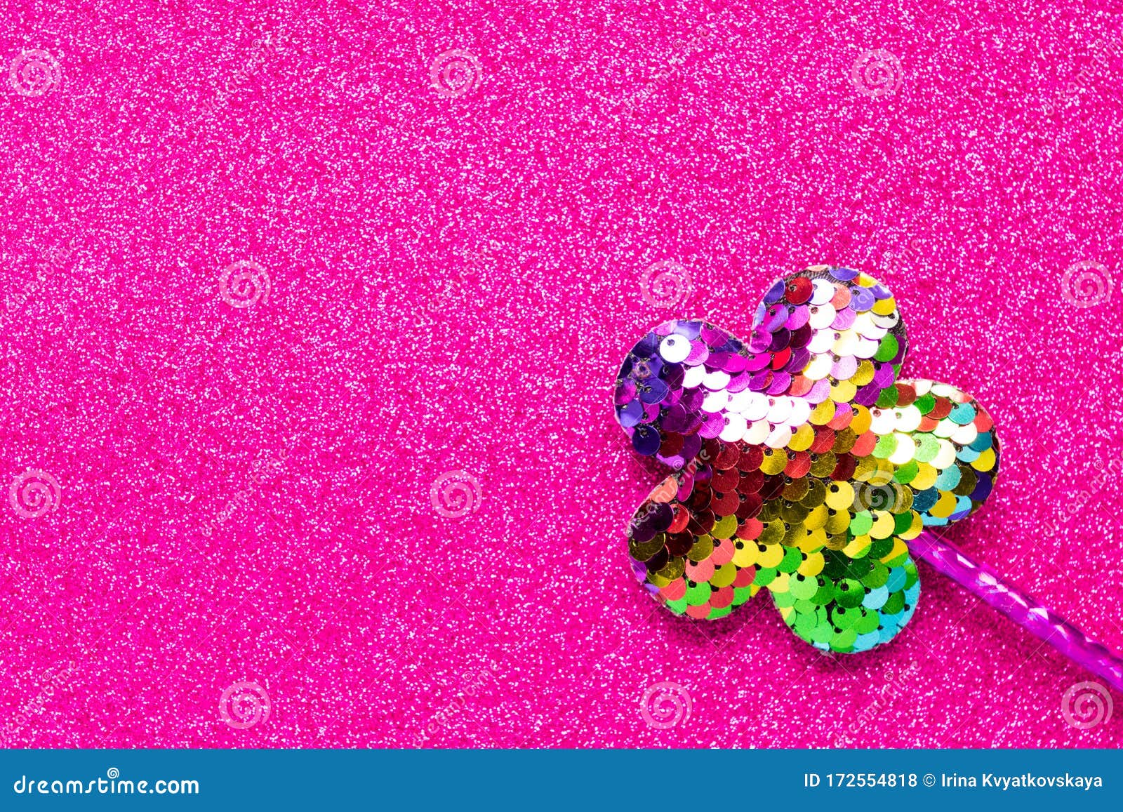 Magic Stick from Sequins in Flower Shape on Pink Glitter Background ...