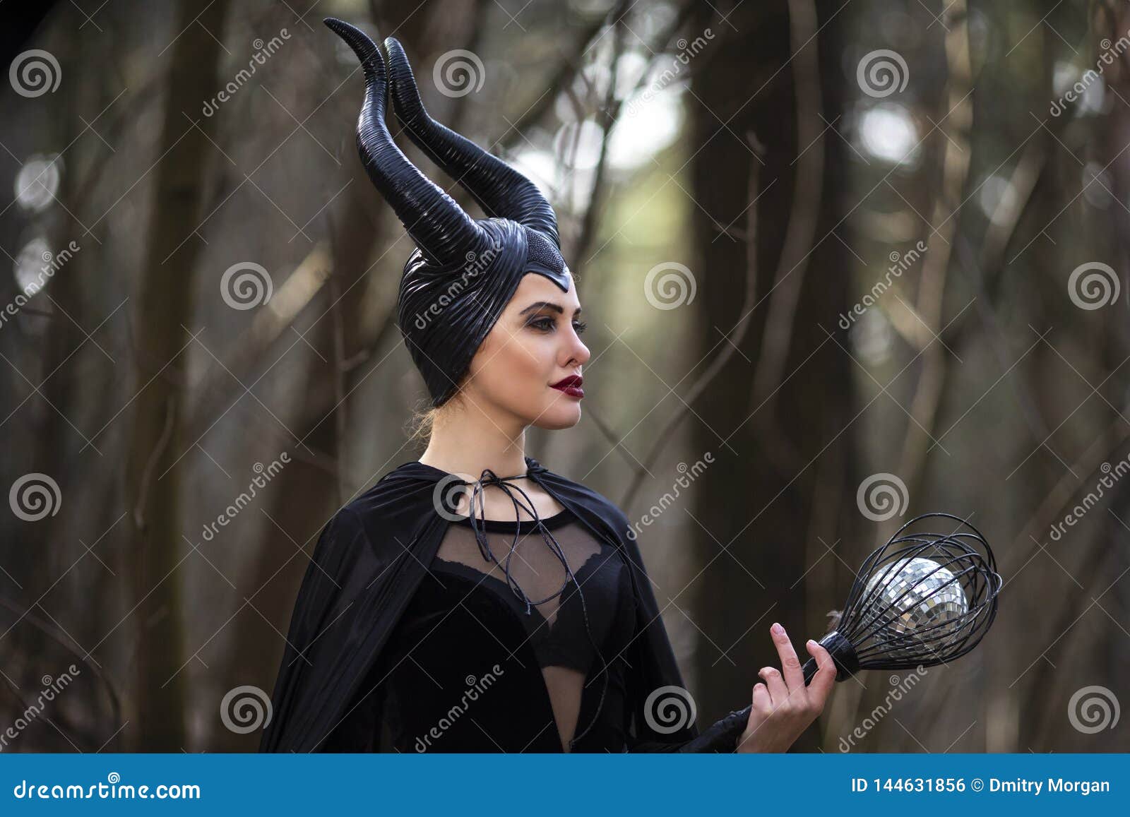 Magical Maleficent Character Posing with Crook in Spring Empty Forest ...