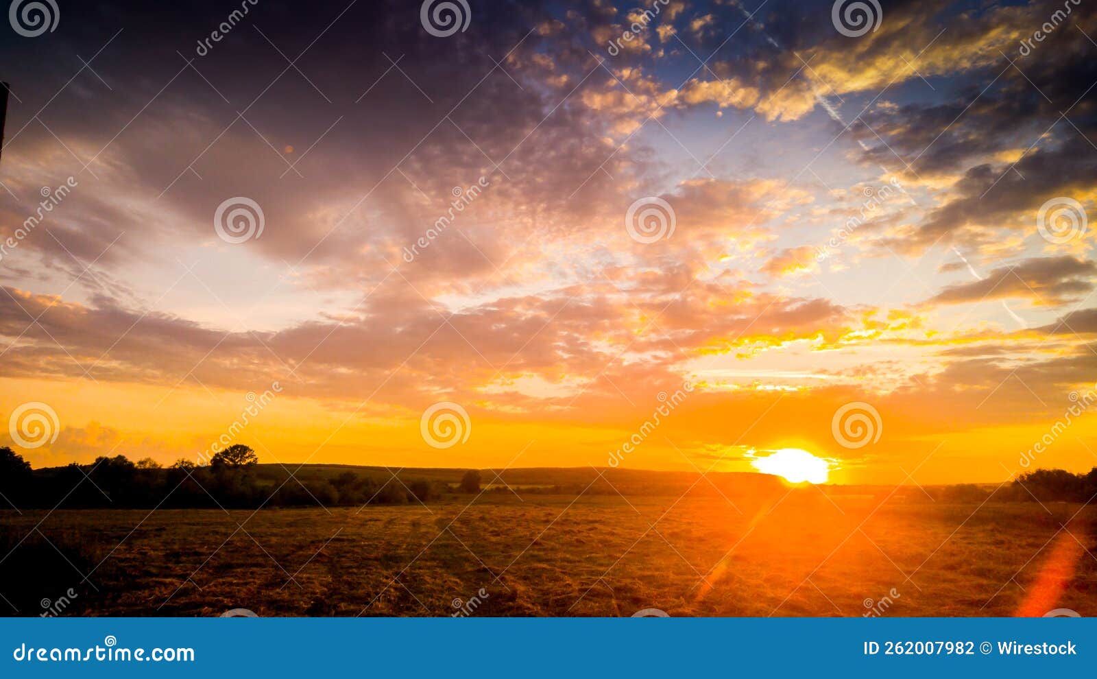 Magical Sunset Over the Field Stock Photo - Image of light, atmosphere ...