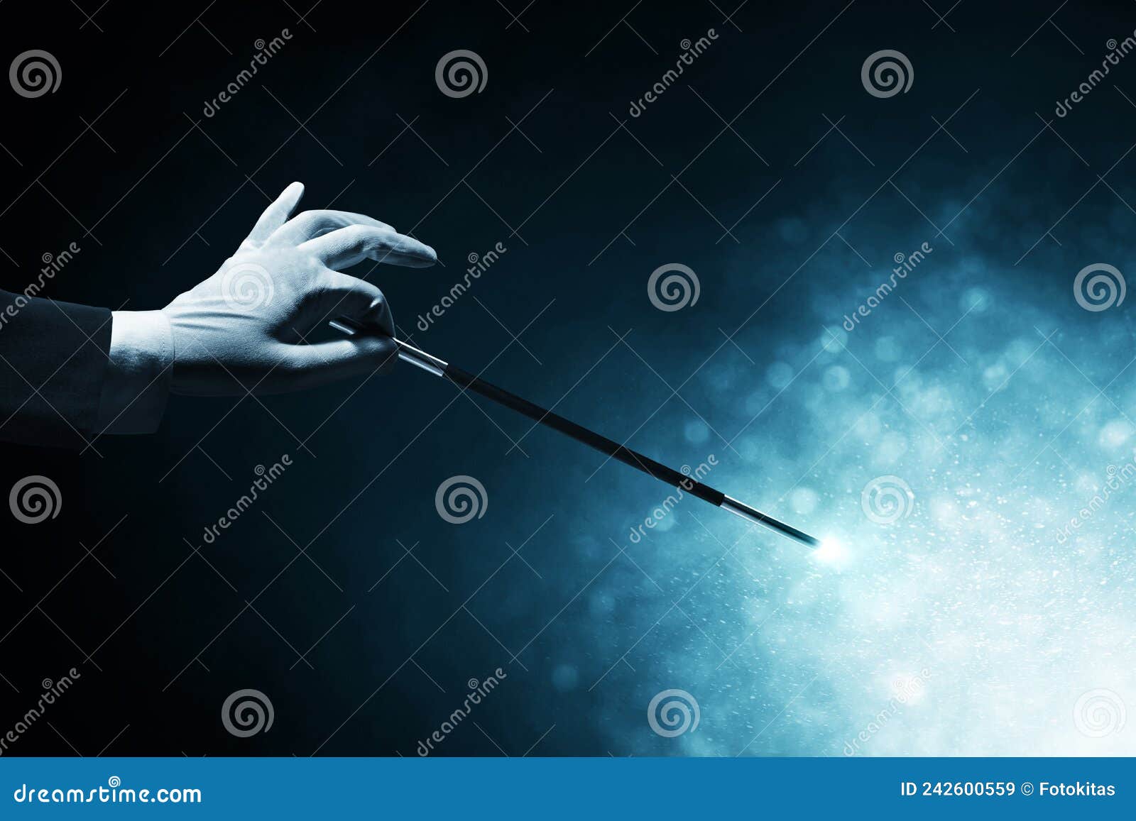 Magician Hand Holding Magic Wand on Dark Backgrounds Stock Image ...