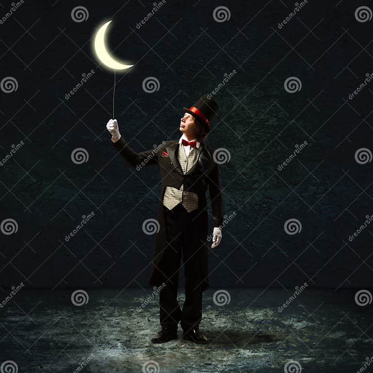Magician Keeps the Moon on a String Stock Image - Image of blue, glow ...