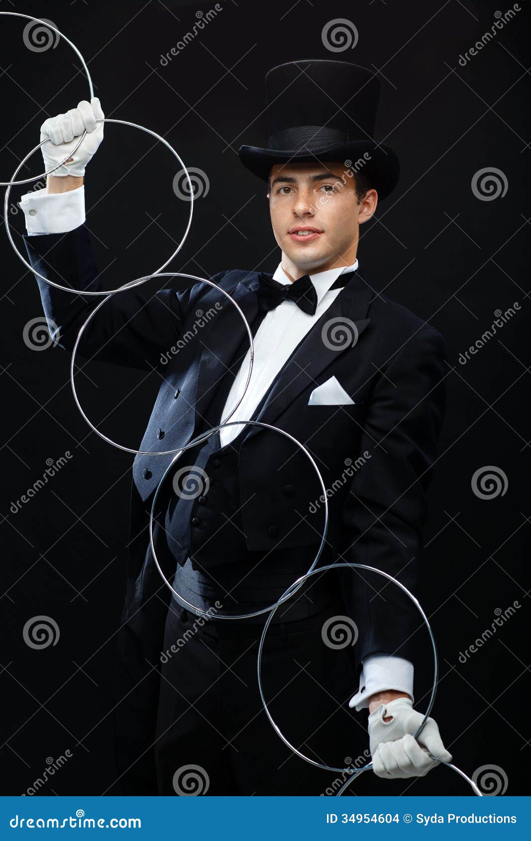 Magician Showing Trick with Linking Rings Stock Photo - Image of play ...