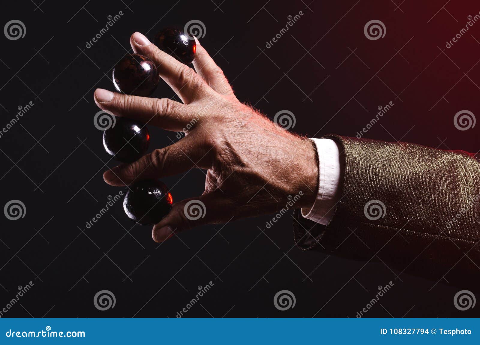 Magician Shows Trick with Magic Balls. Manipulation with Props. Stock ...