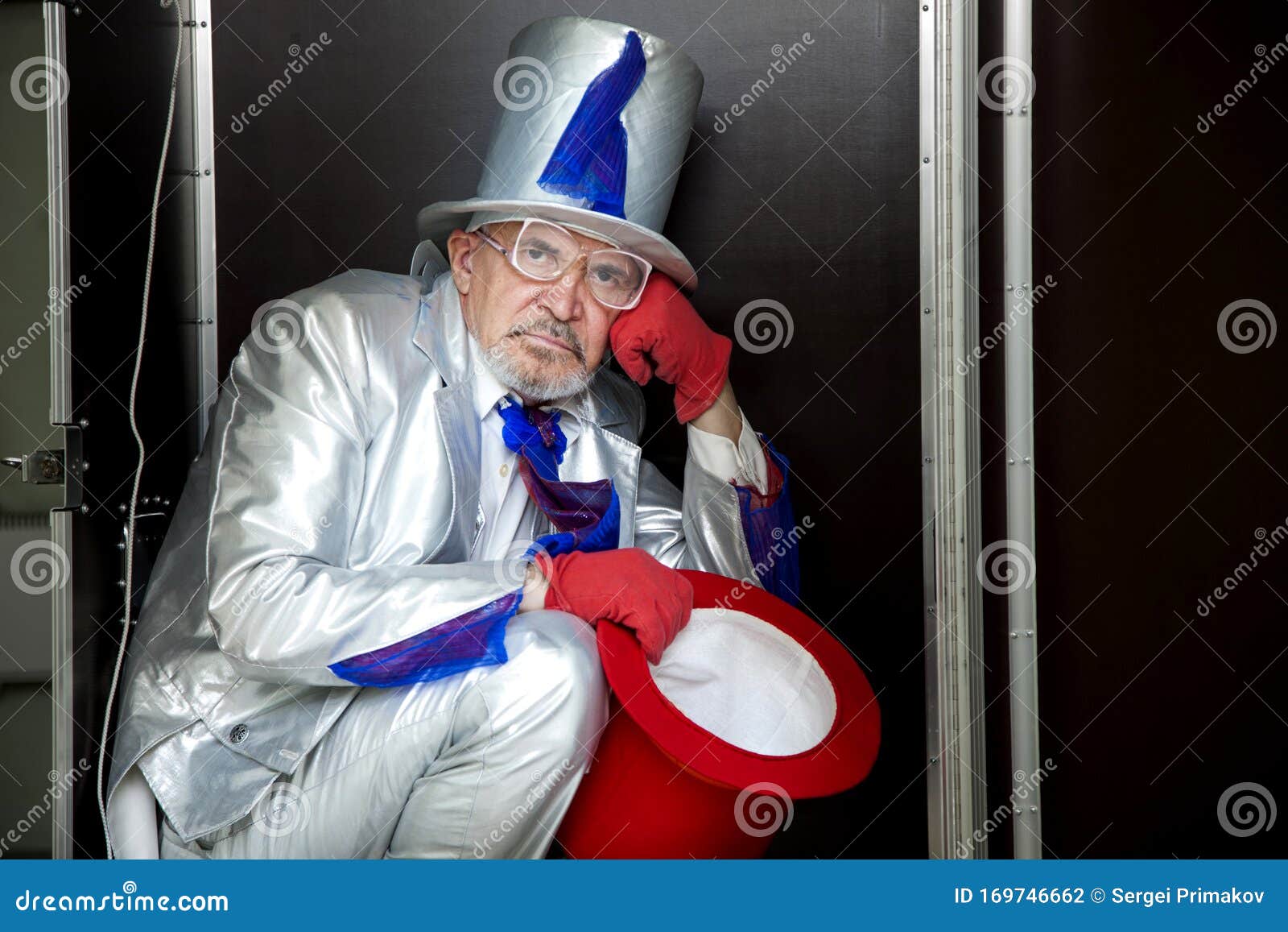 Magician sitting in a box stock photo. Image of abracadabra - 169746662