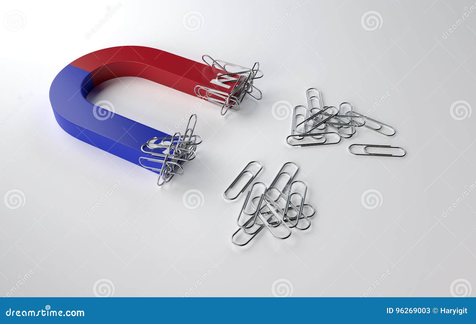 Magnet Attracts Paper Clips On White Background. Royalty-Free Stock ...