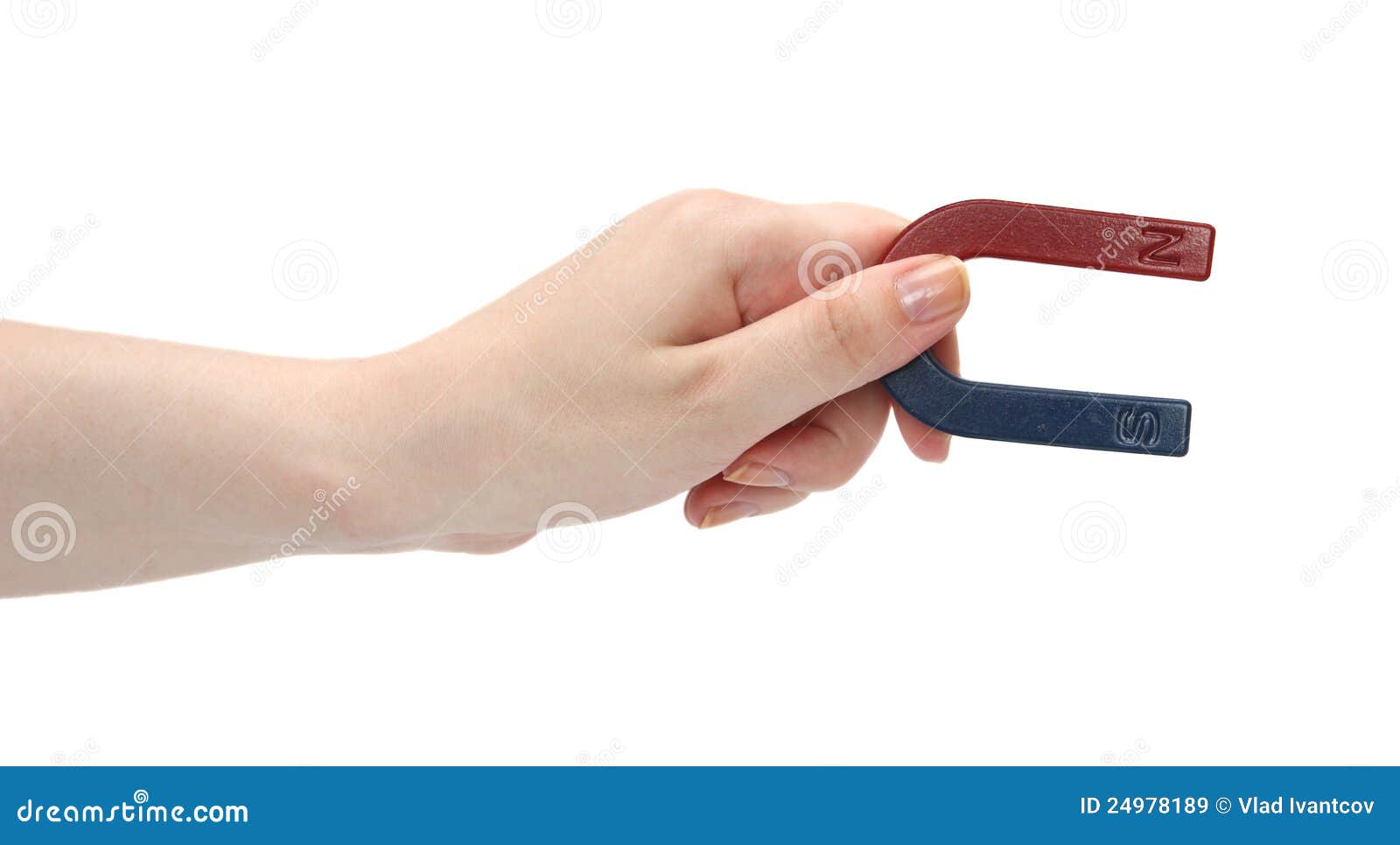 Magnet in a female hand. stock image. Image of cutout - 24978189