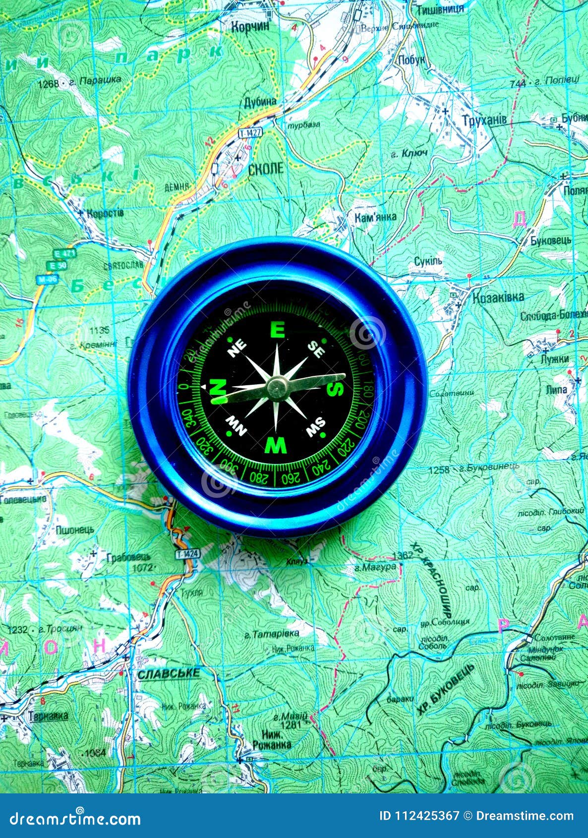 Magnetic Compass Blue on the Road Map. Stock Image - Image of middle ...