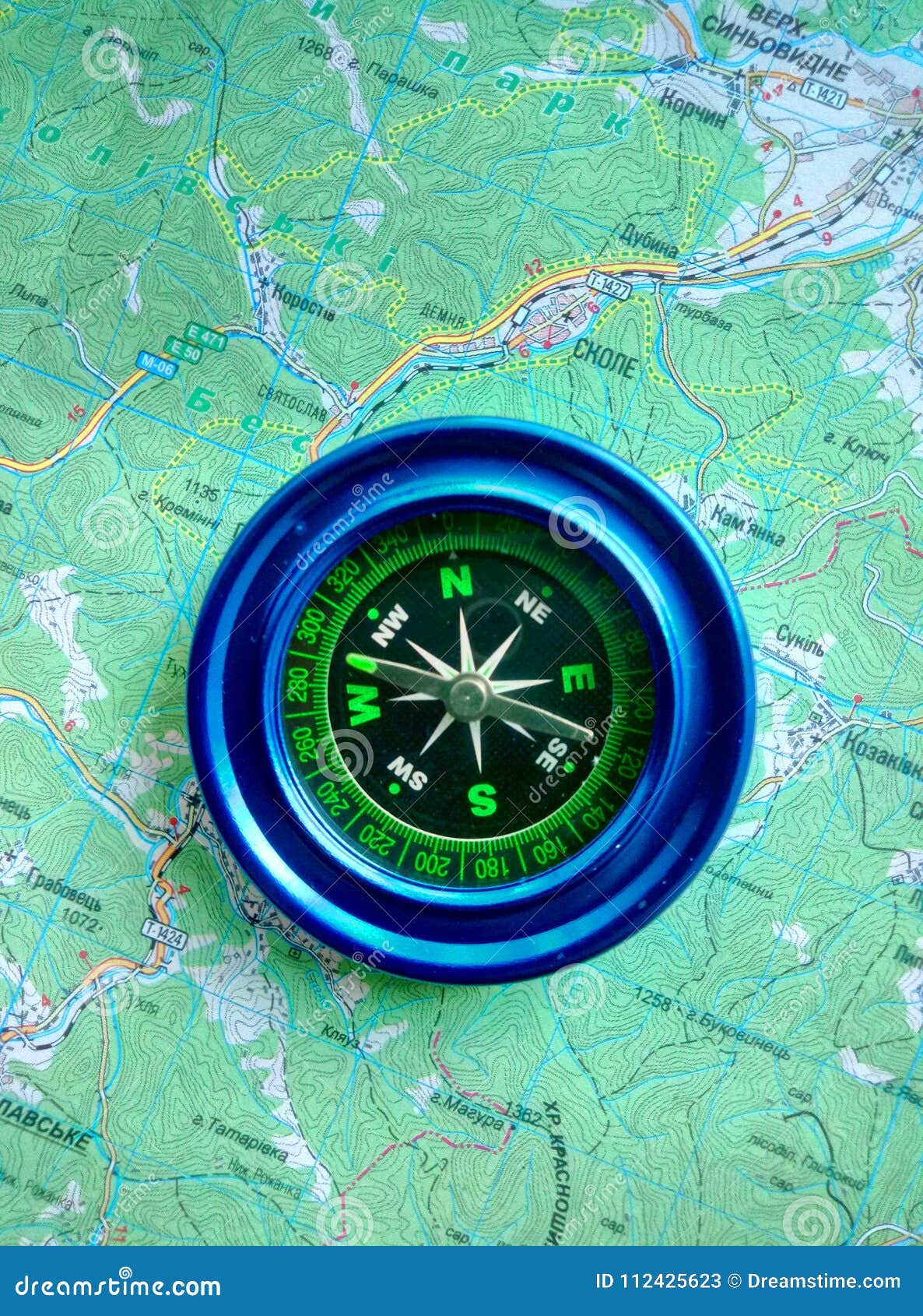 Magnetic Compass Blue on the Road Map. Stock Image - Image of earth ...