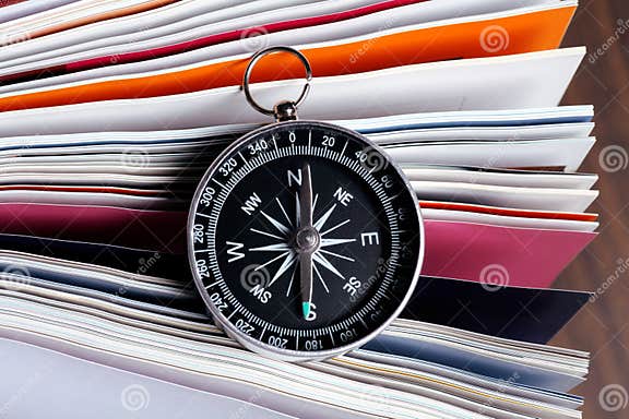Magnetic compass on a book stock photo. Image of measurement - 6505306