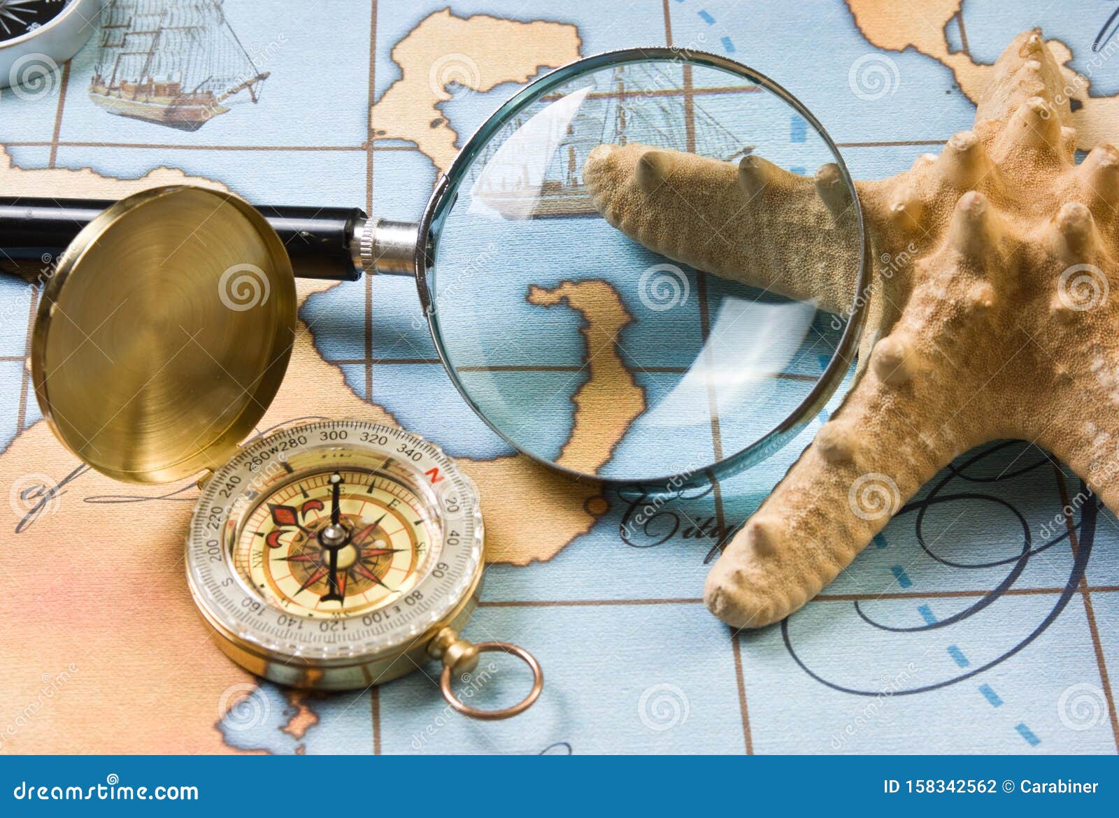 Magnifier and Compass on Map Stock Photo - Image of destinations, loupe ...