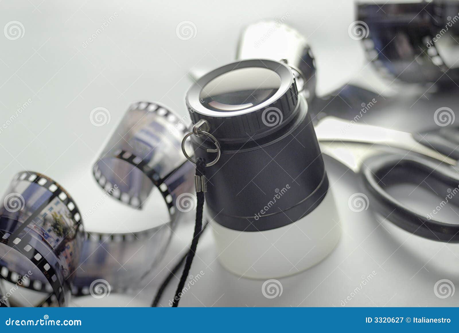 Magnifier and film stock image. Image of photographic - 3320627