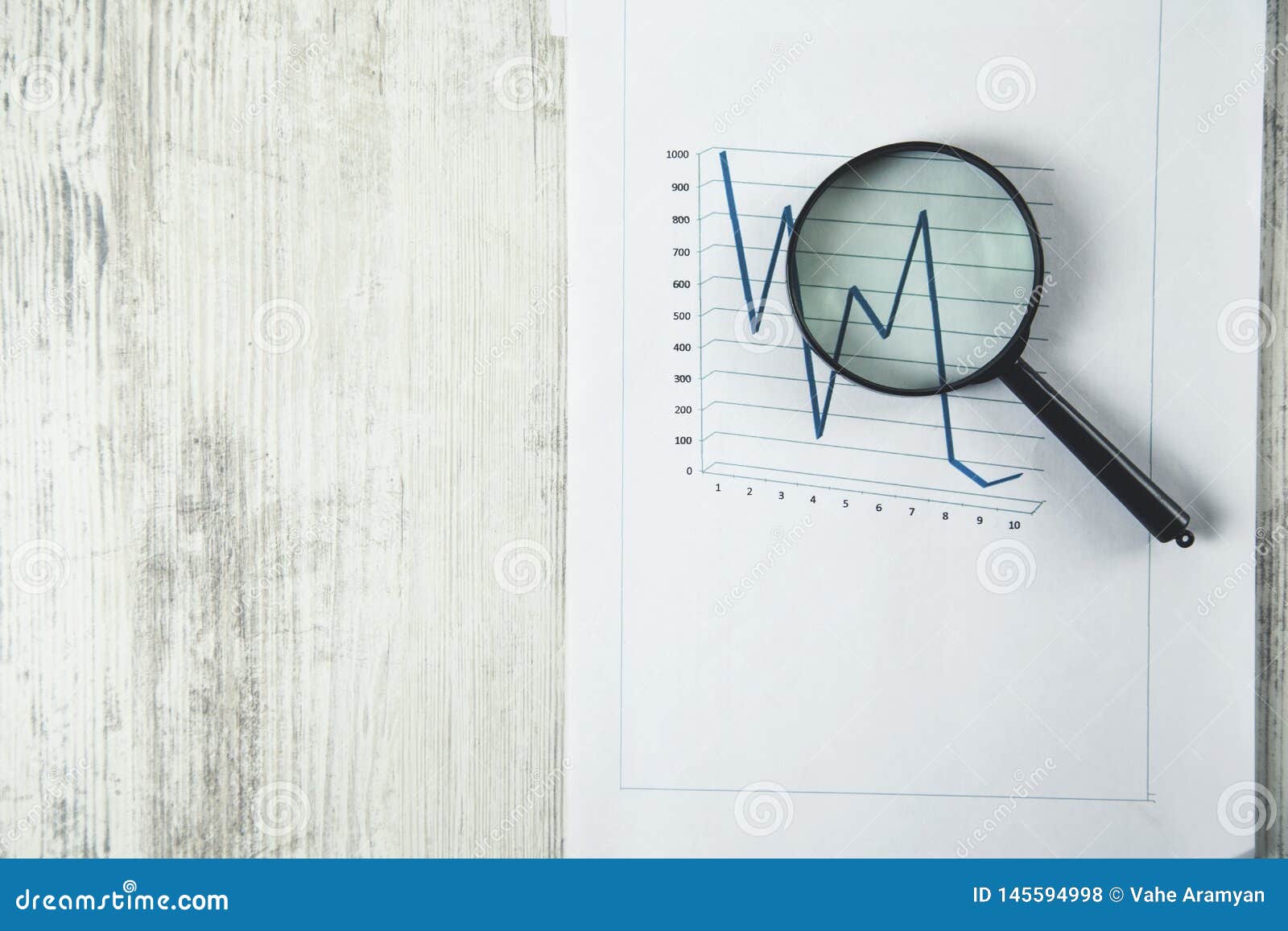 Magnifier on graph stock photo. Image of document, chart - 145594998
