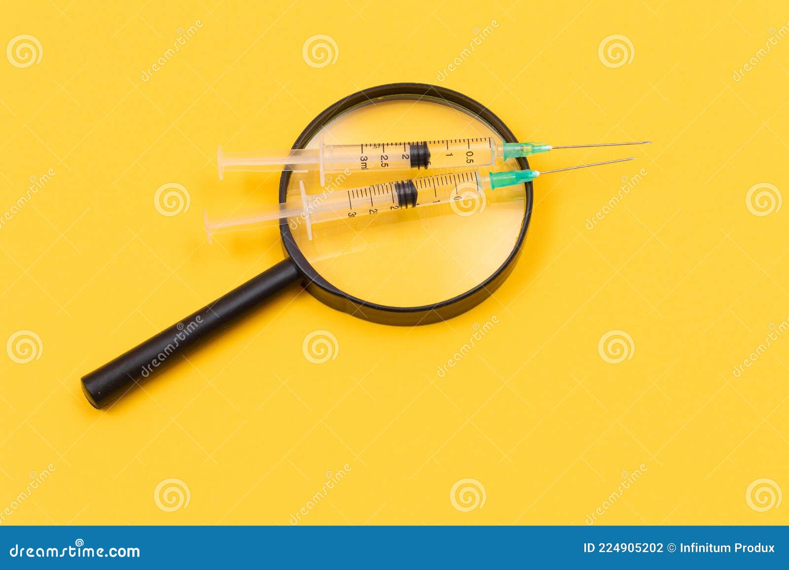 A Magnifier with Medical Syringe on Yellow Table Stock Photo - Image of ...