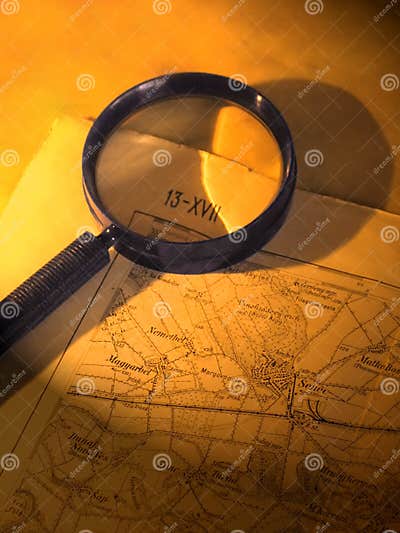 A Magnifier on an old map stock image. Image of explore - 131283