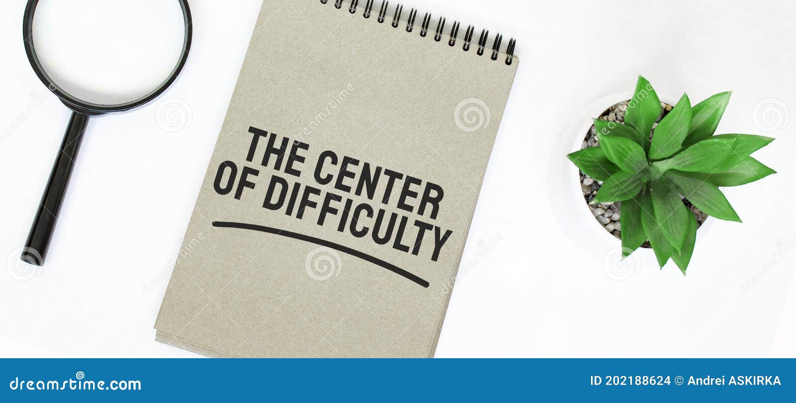 A Magnifying Glass, a Blank Brown Notebook on a White Table. Center of ...