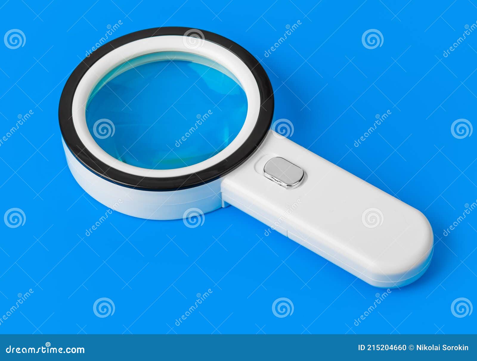 Magnifying glass on blue stock photo. Image of optical - 215204660
