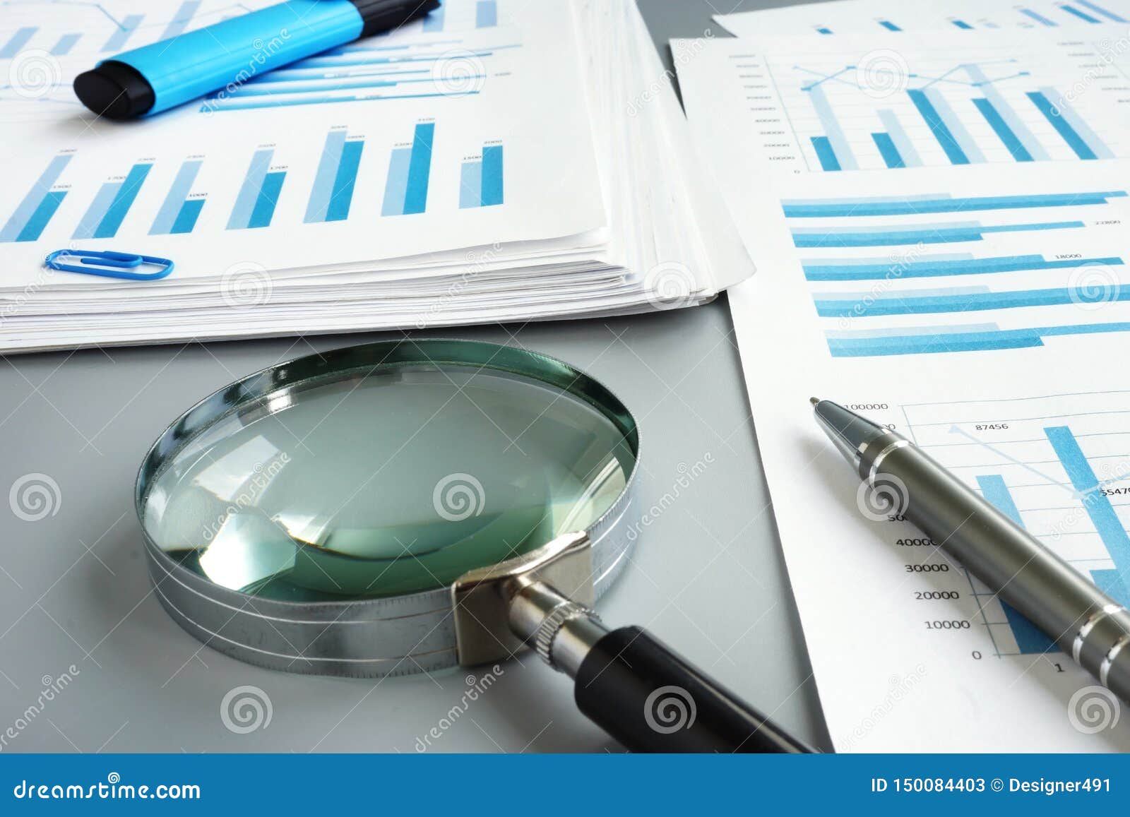 Auditing. Magnifying Glass On Financial Documents With Graphs. Audit ...