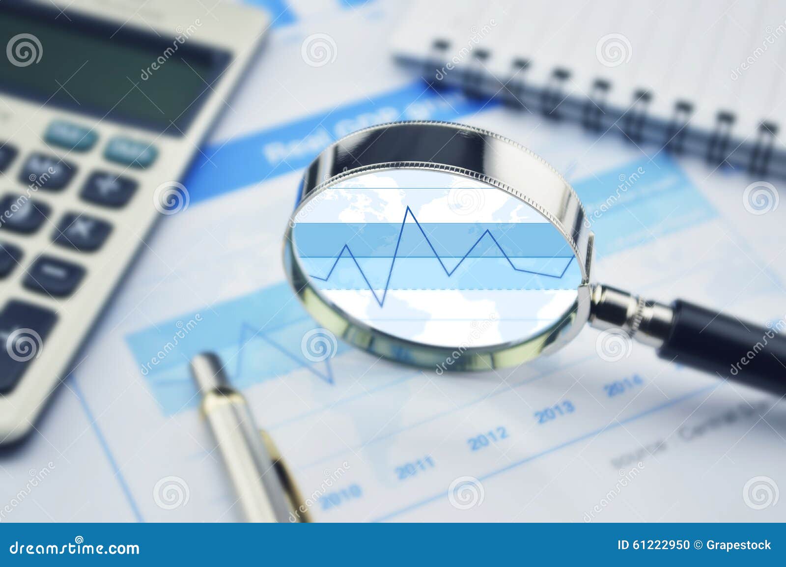 Magnifying Glass, Calculator and Pen on Financial Graph Stock Photo ...