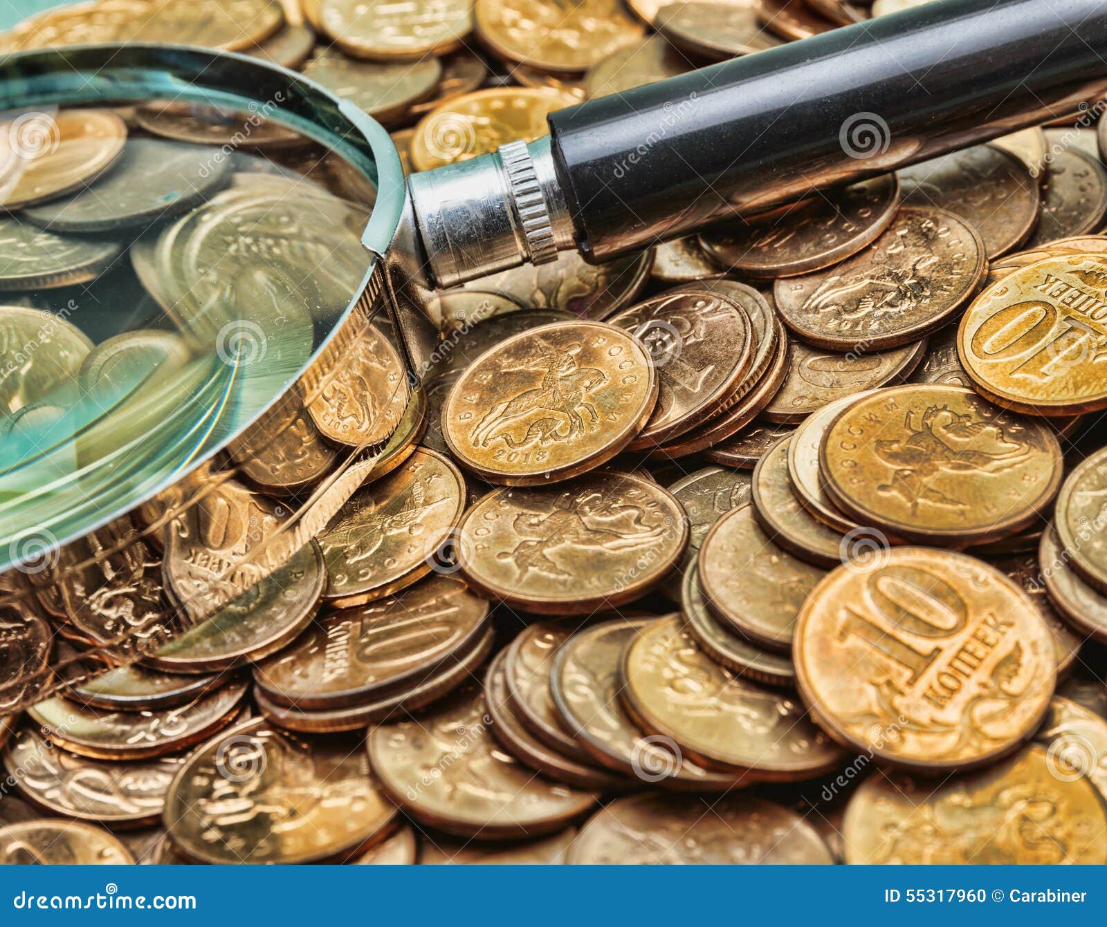 Magnifying Glass on a Coins Stock Photo - Image of glass, loupe: 55317960