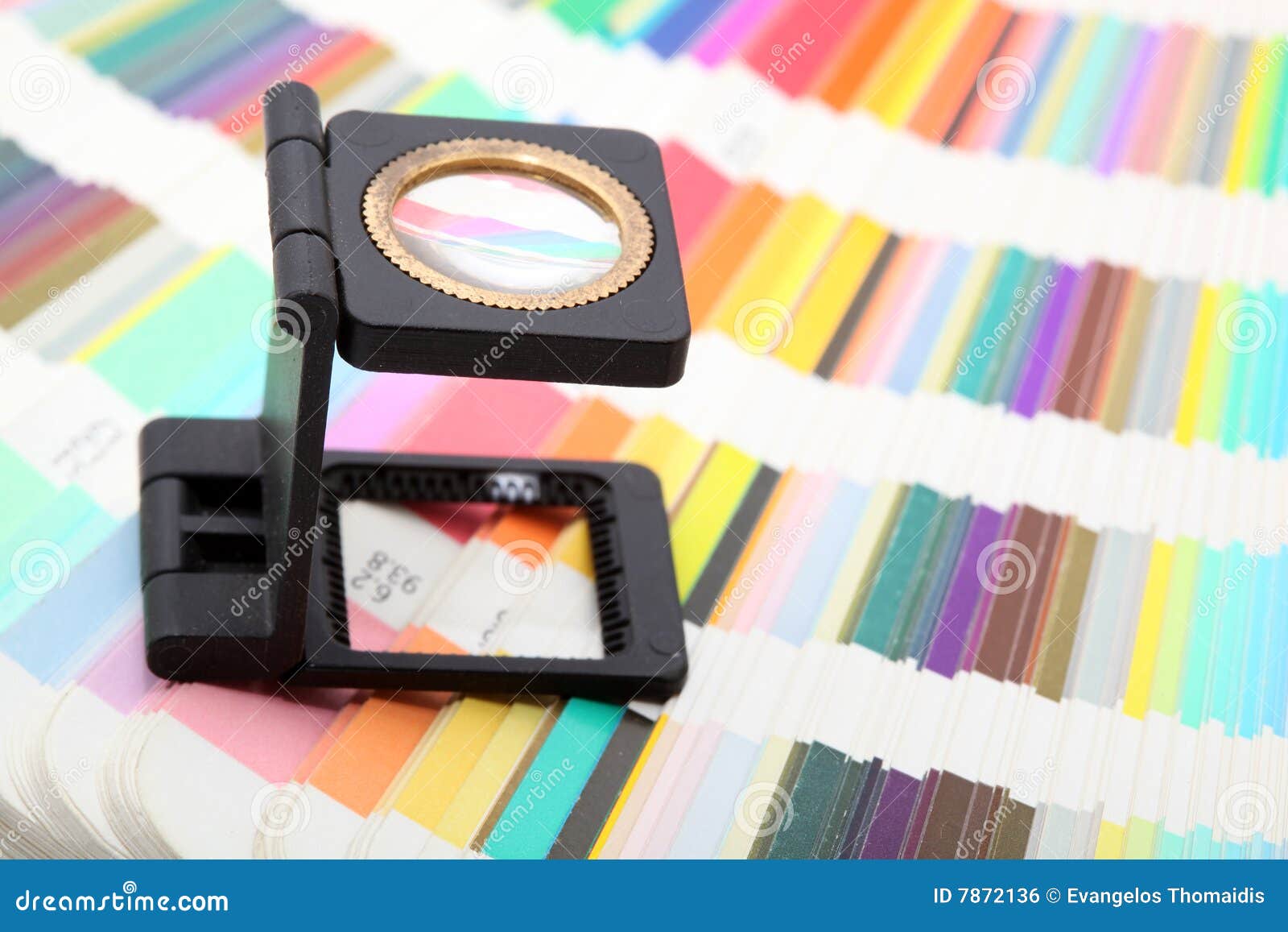 Magnifying glass on colors stock photo. Image of graphic - 7872136
