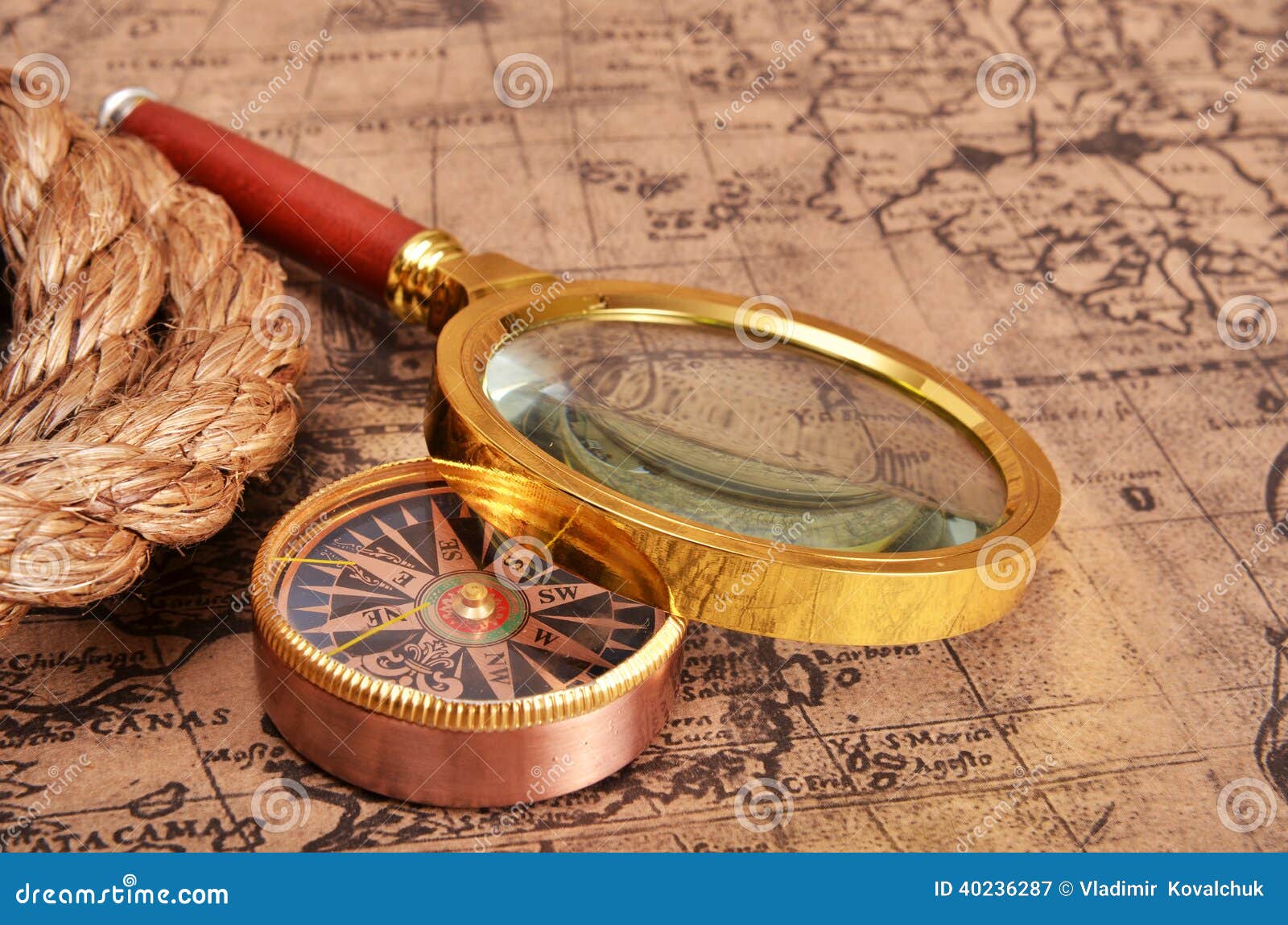 Magnifying Glass and Compass on the Ancient Map Stock Image - Image of ...